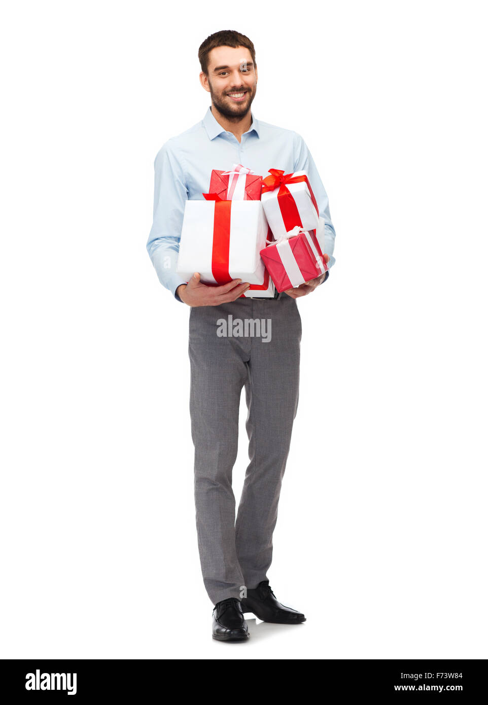 happy young man holding gift boxes Stock Photo - Alamy