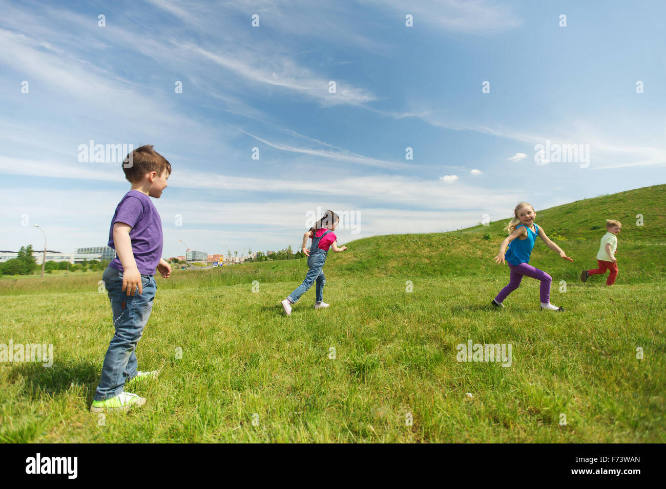 group of happy kids running outdoors Stock Photo - Alamy