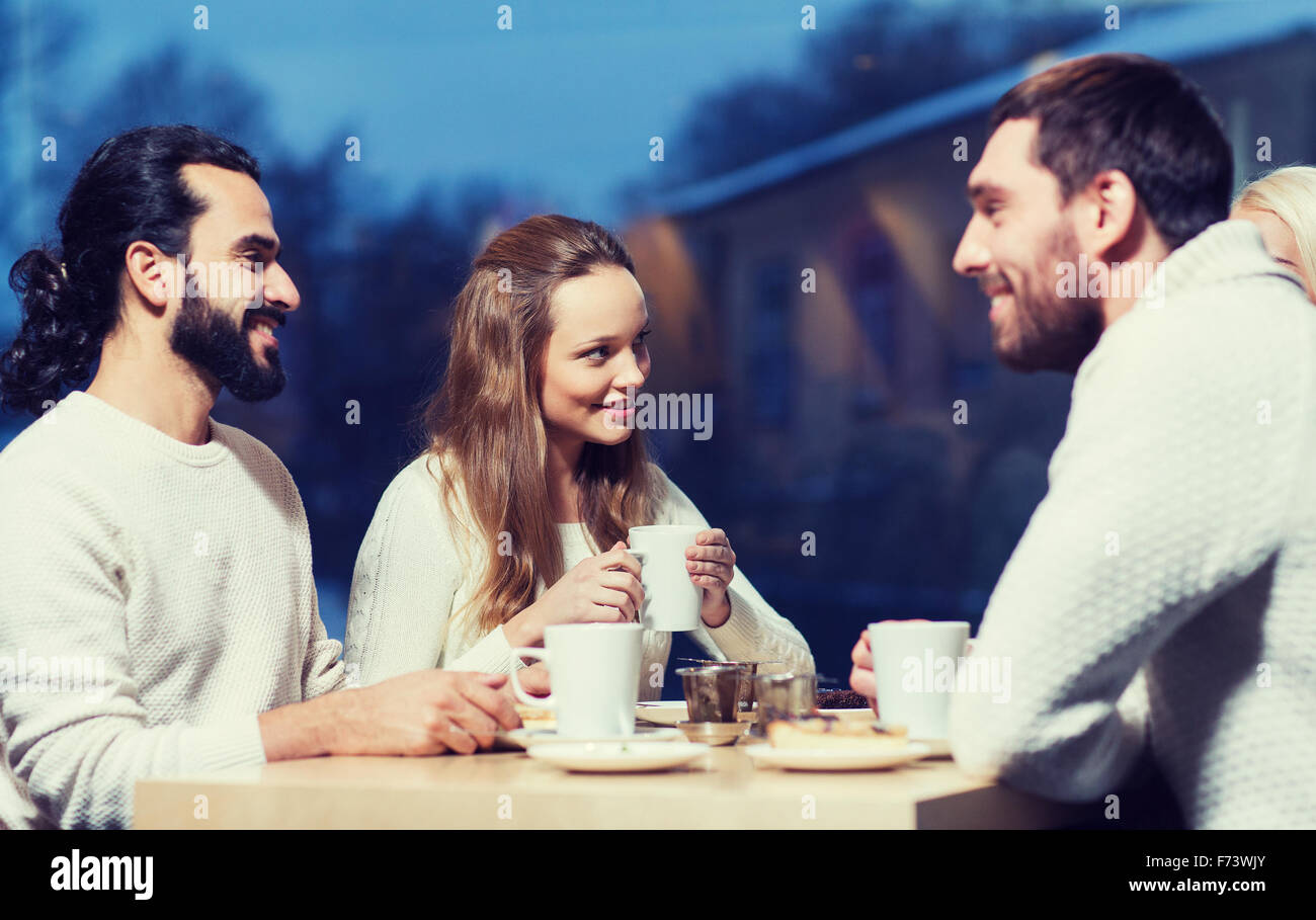 happy friends meeting and drinking tea or coffee Stock Photo - Alamy