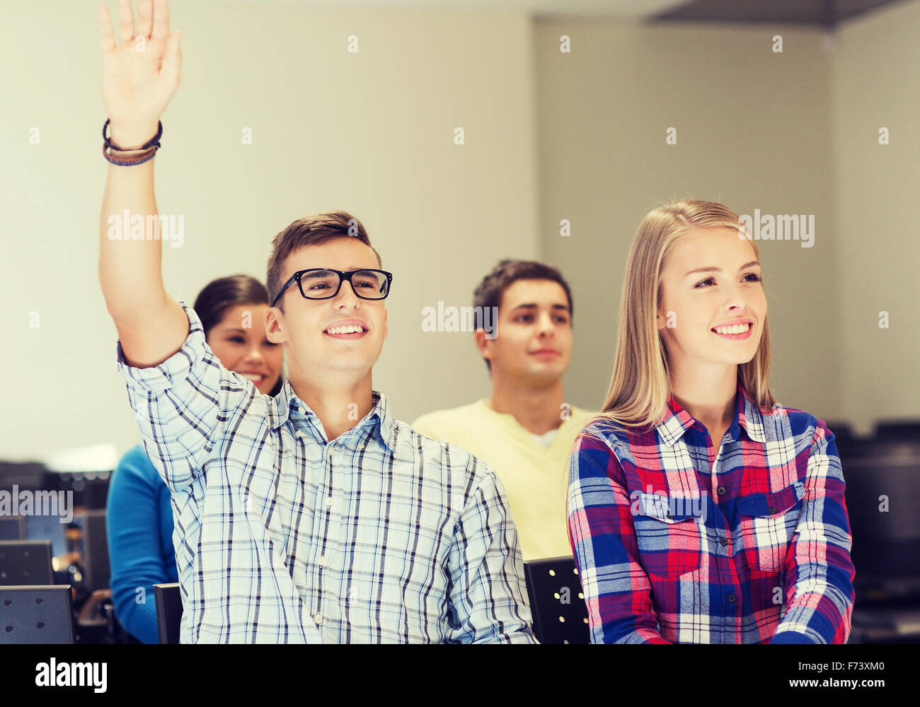 group of smiling students in lecture hall Stock Photo - Alamy