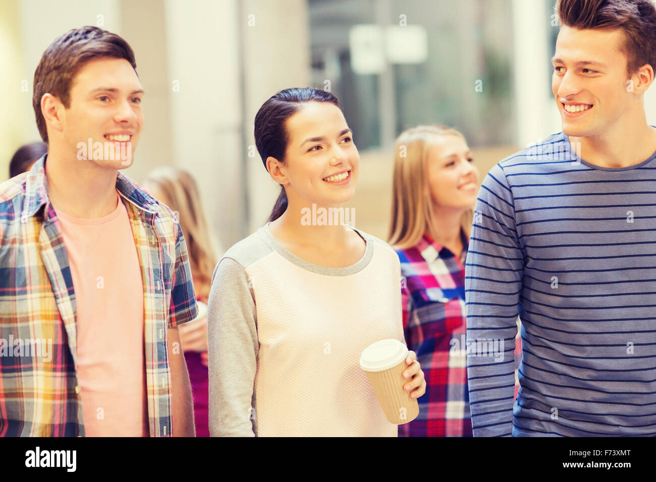 group of smiling students with paper coffee cups Stock Photo - Alamy