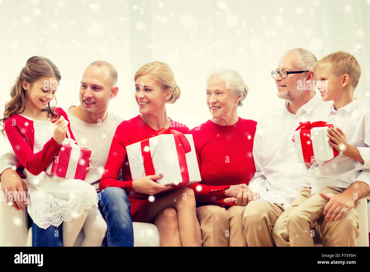 smiling family with gifts at home Stock Photo - Alamy