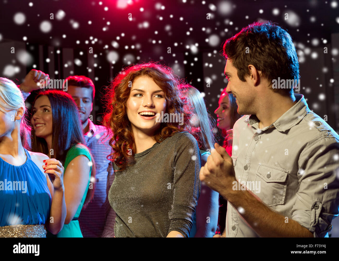 smiling friends dancing in club Stock Photo - Alamy