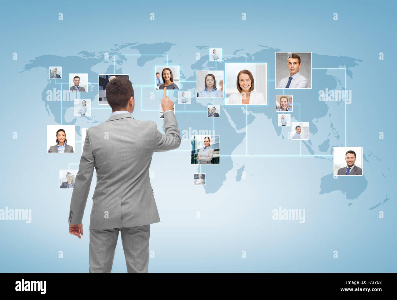 businessman pointing finger to contact icons Stock Photo - Alamy