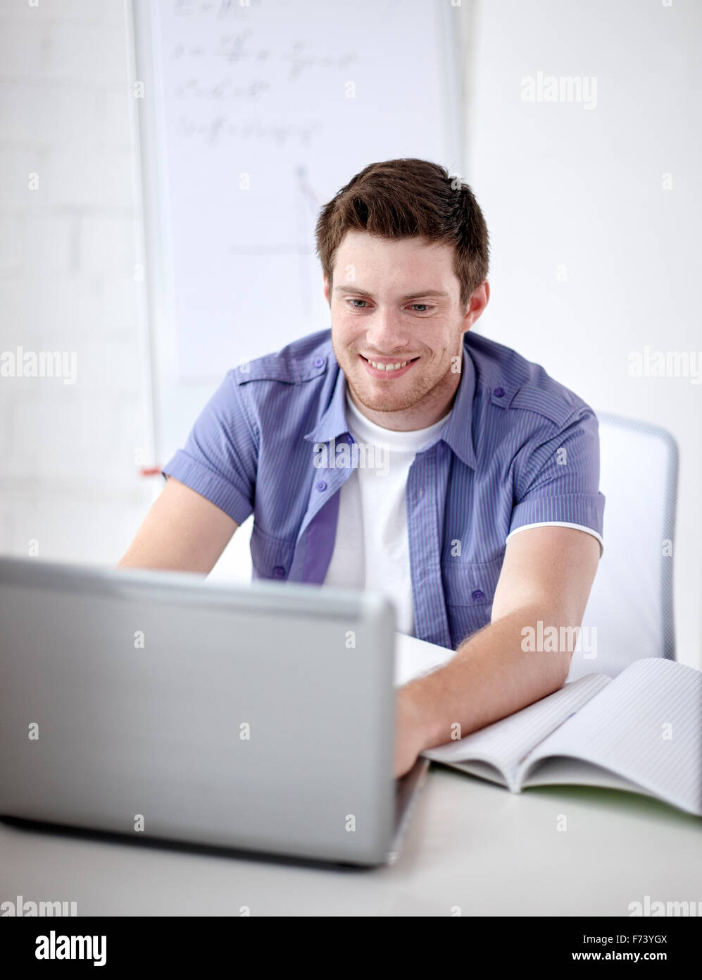 high school student with laptop in classroom Stock Photo - Alamy