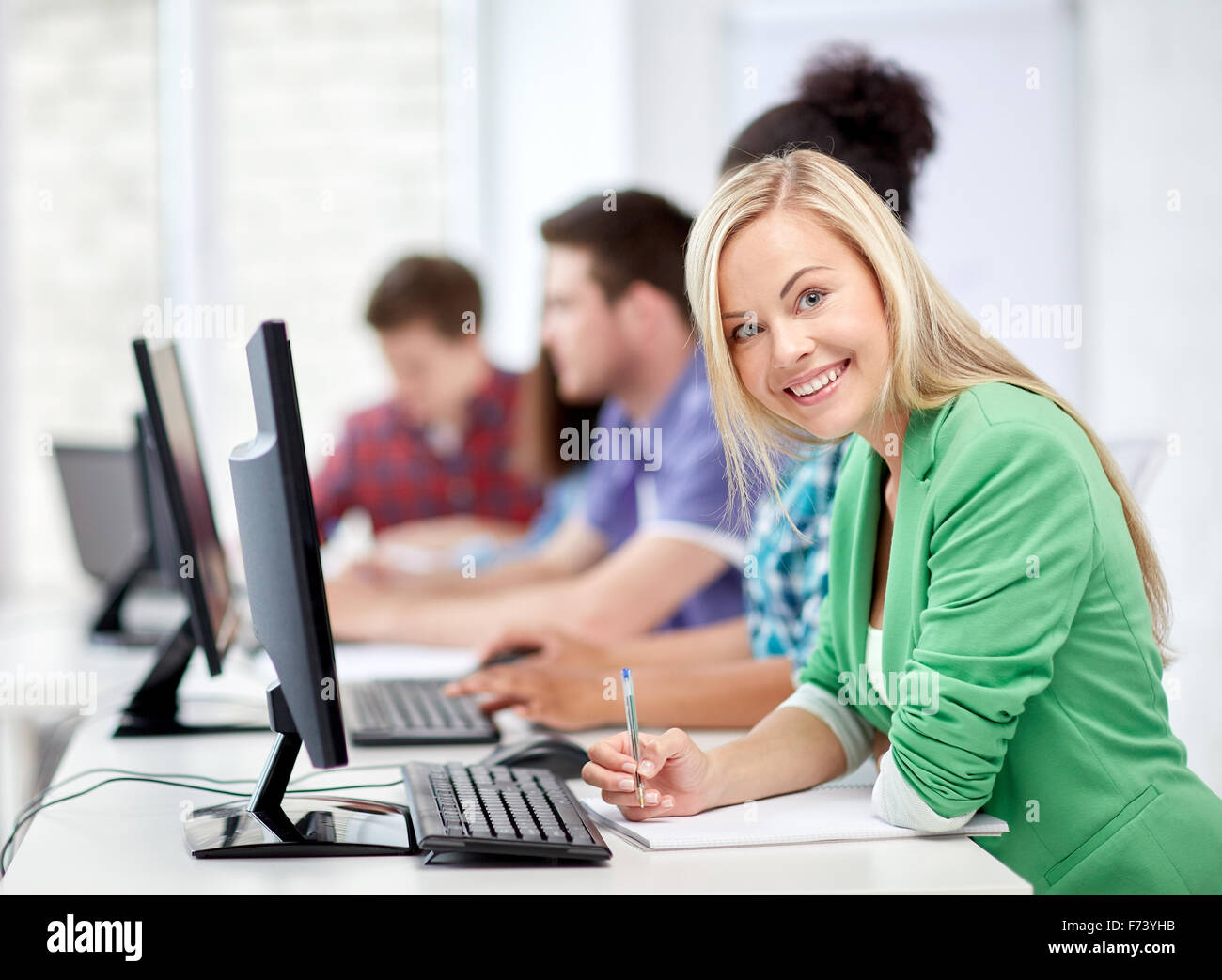 happy high school students in computer class Stock Photo - Alamy