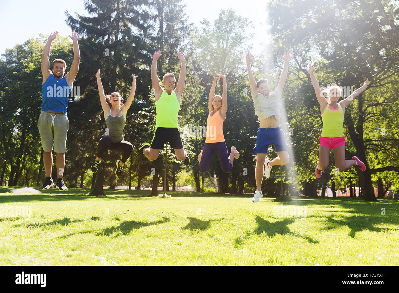 group of happy friends jumping high outdoors Stock Photo - Alamy