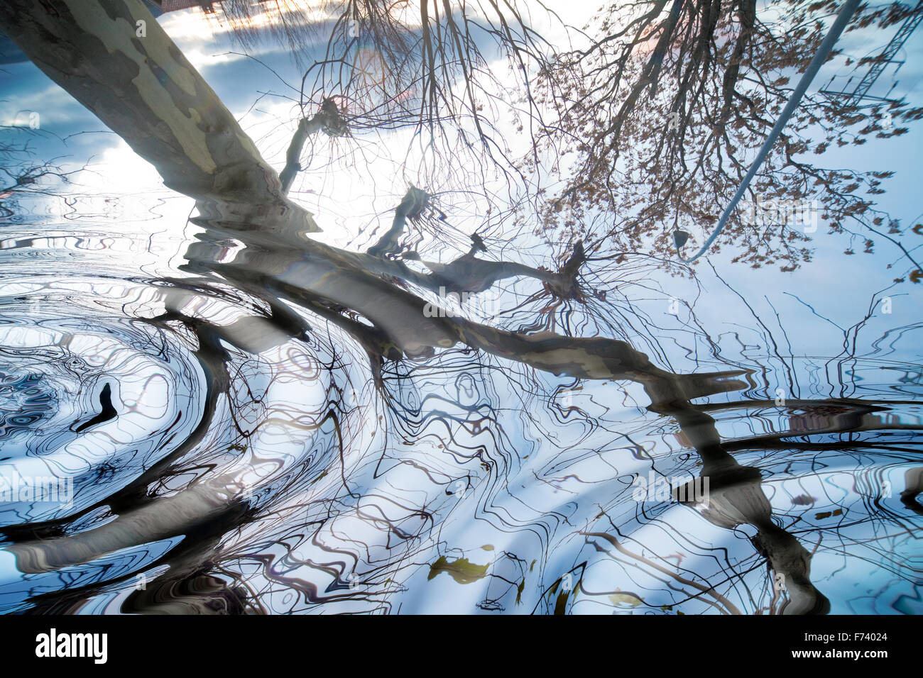 Detail of reflections on the water with waves Stock Photo - Alamy