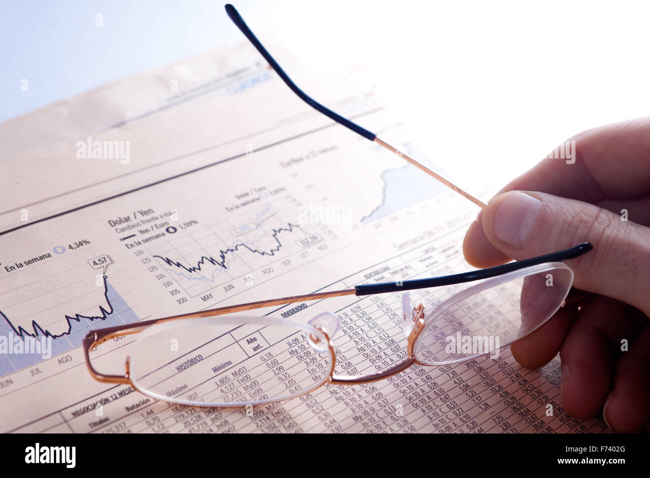 Graphics and statistics with businessman's hand Stock Photo - Alamy