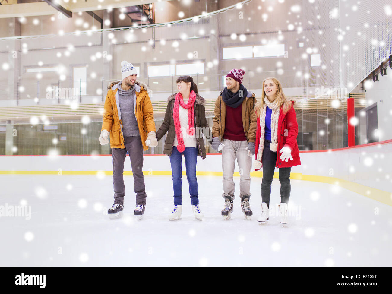 happy friends on skating rink Stock Photo - Alamy