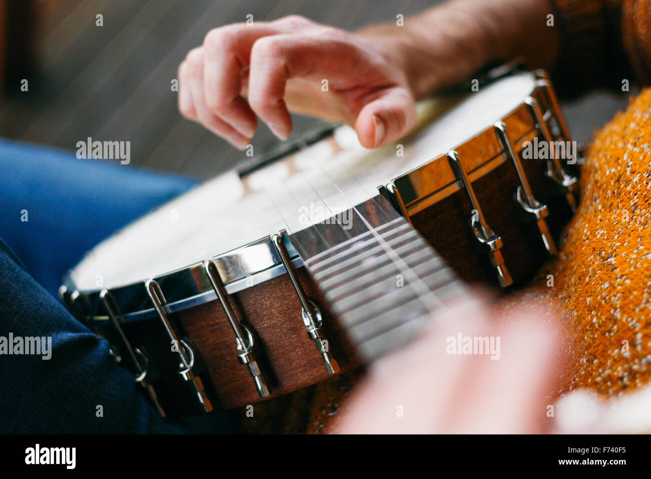 Male Banjo player practicing some country and folk music Stock Photo ...