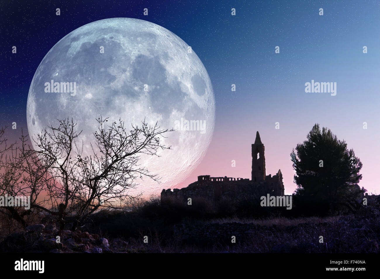 Mysterious landscape with full moon and church Stock Photo - Alamy