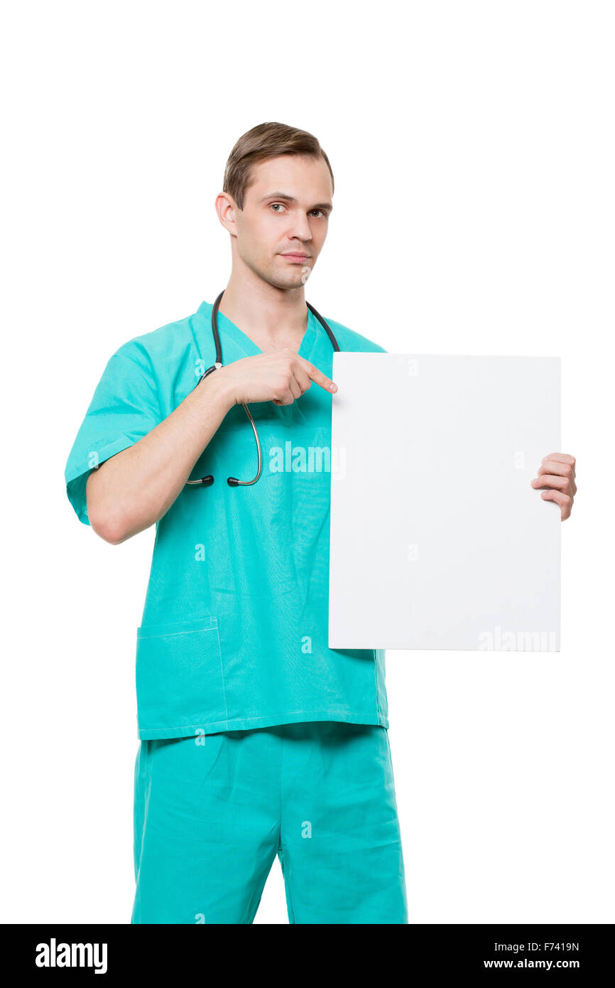 A smiling doctor holding a white blank card isolated on white ...