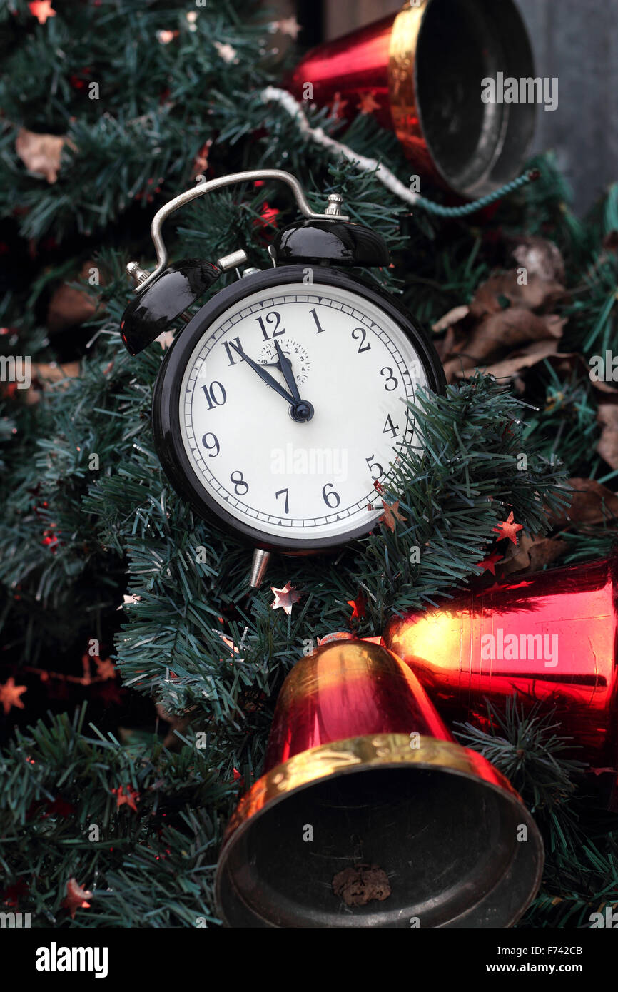 Christmas: Vintage alarm clock with hand bells on a New Year tree Stock ...