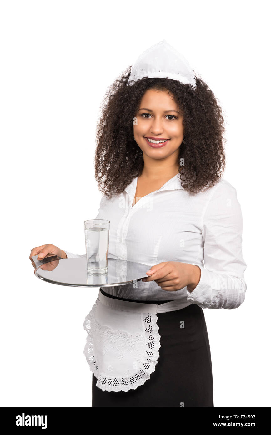 Cut out image of a young smiling maid who is serving a glass of water ...