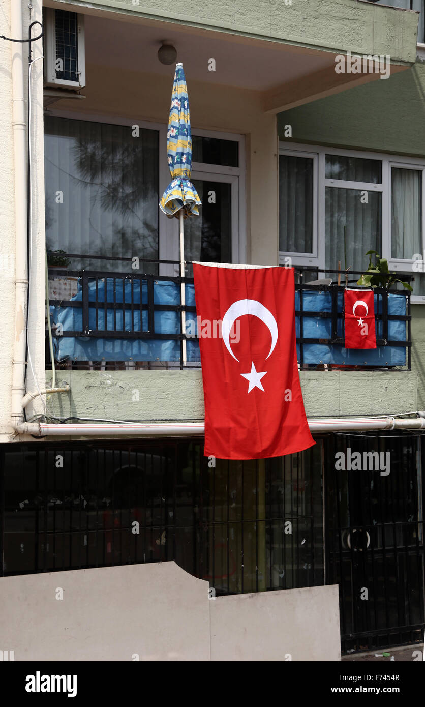 Pair of Turkish flags flying on an apartment block in Istanbul, Turkey ...