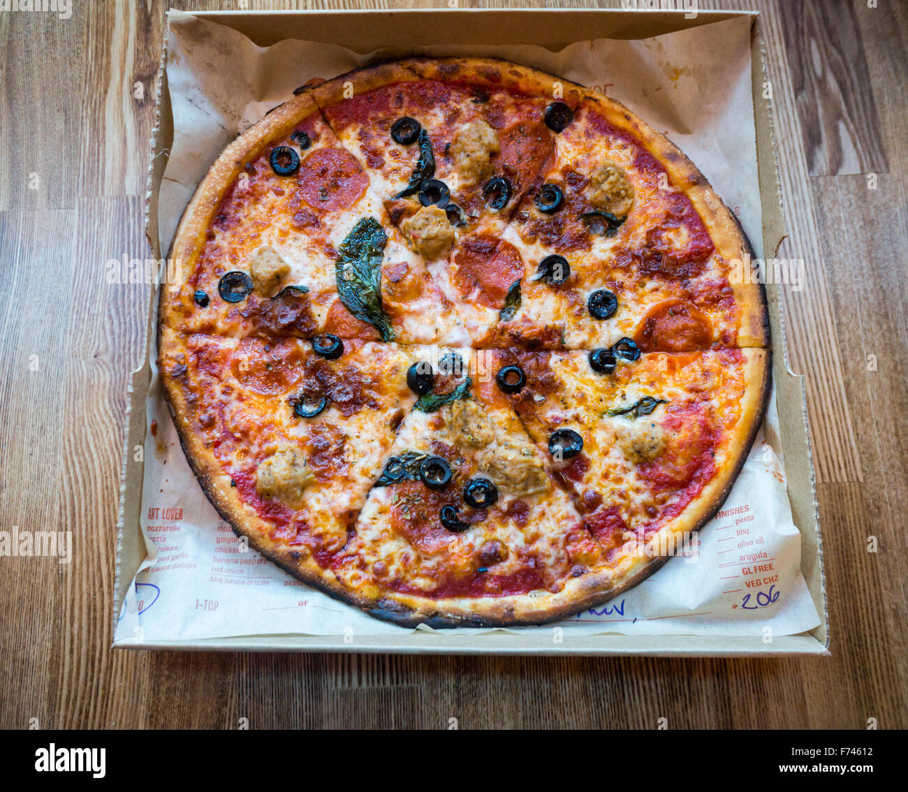 A custom made pizza ready for take out at the newly opened Blaze Pizza ...