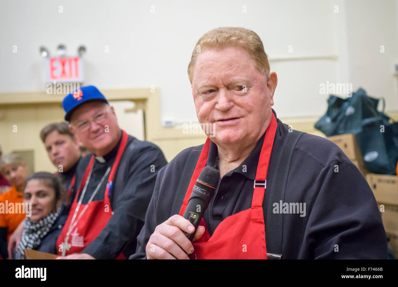 Former baseball player Rusty Staub speaks at a Thanksgiving food give ...