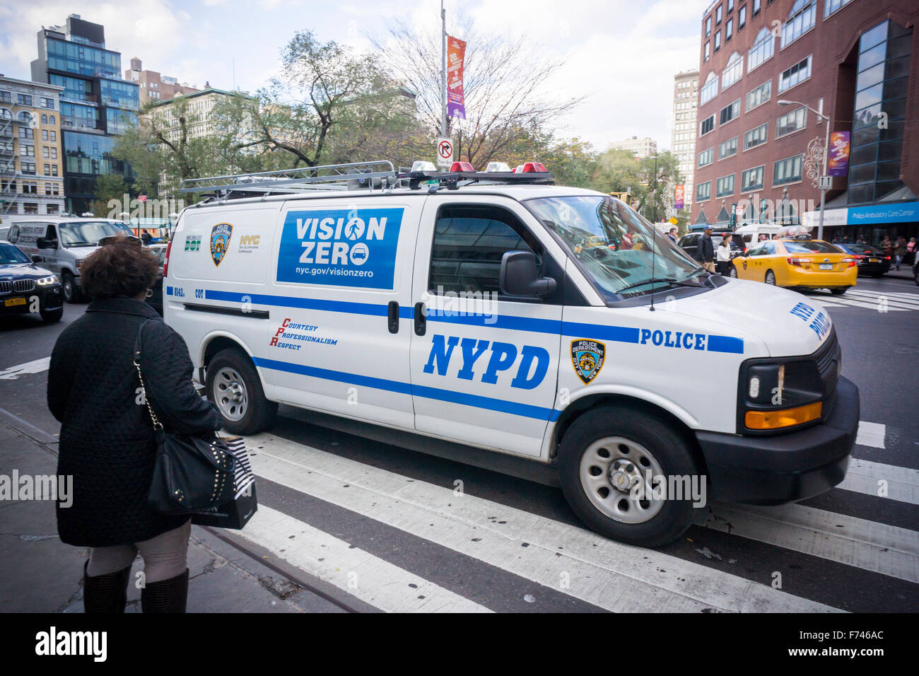 An NYPD van equipped with speakers and signage warns pedestrians of the ...
