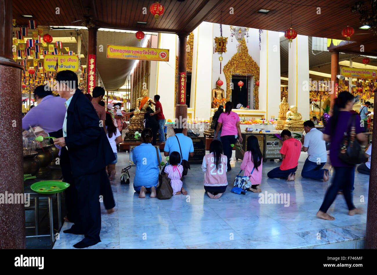 People praying Luang Pho Wat Rai Khing is a statue of Buddha at ...