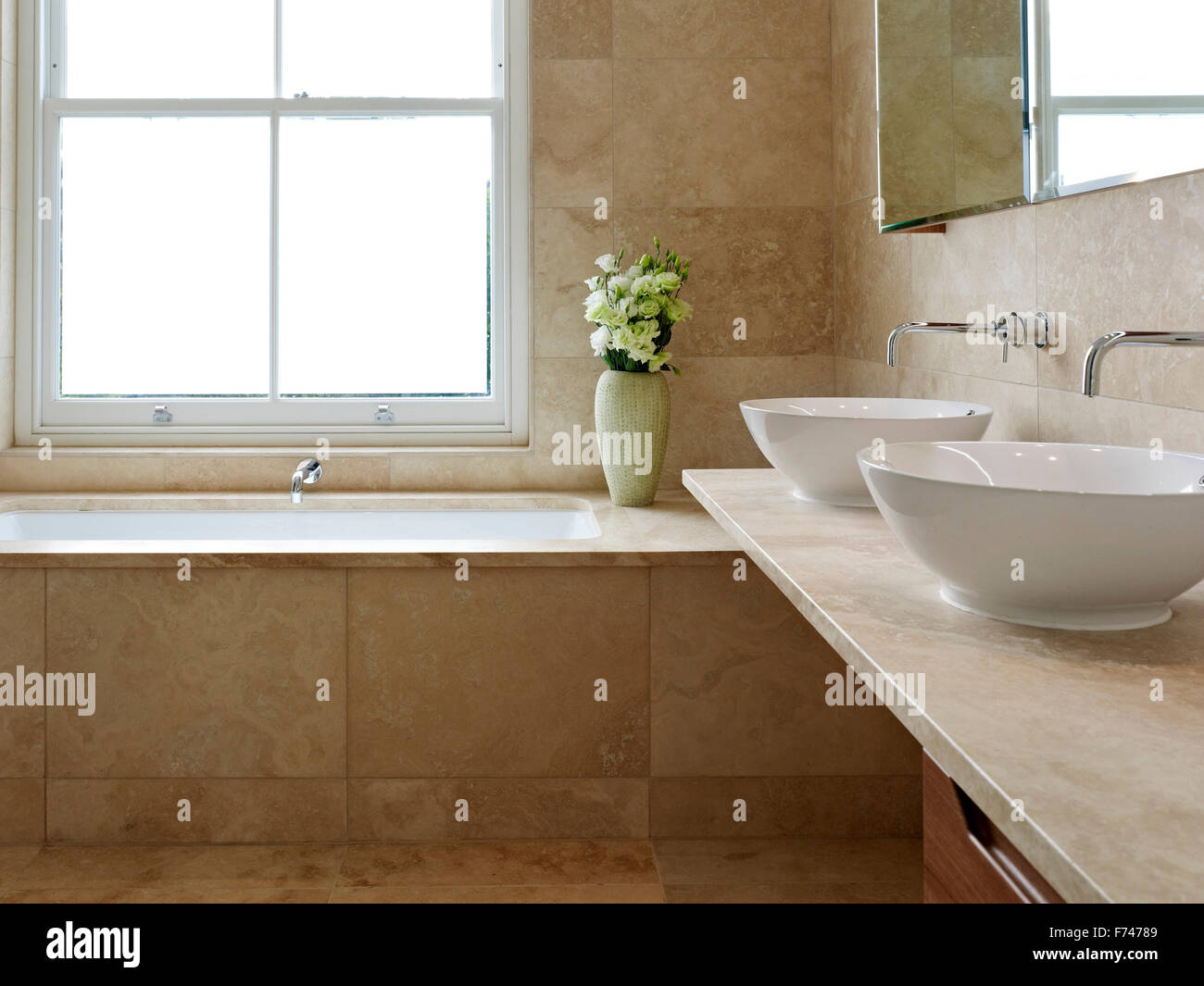 Double basins and bath at uncurtained window in Wolverton Gardens ...
