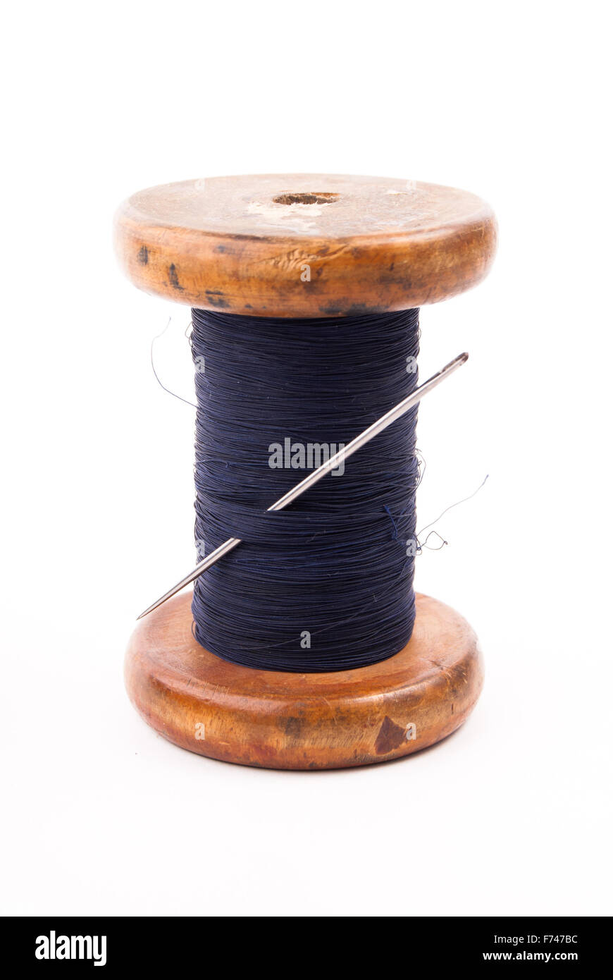 spool of thread with needle Stock Photo - Alamy