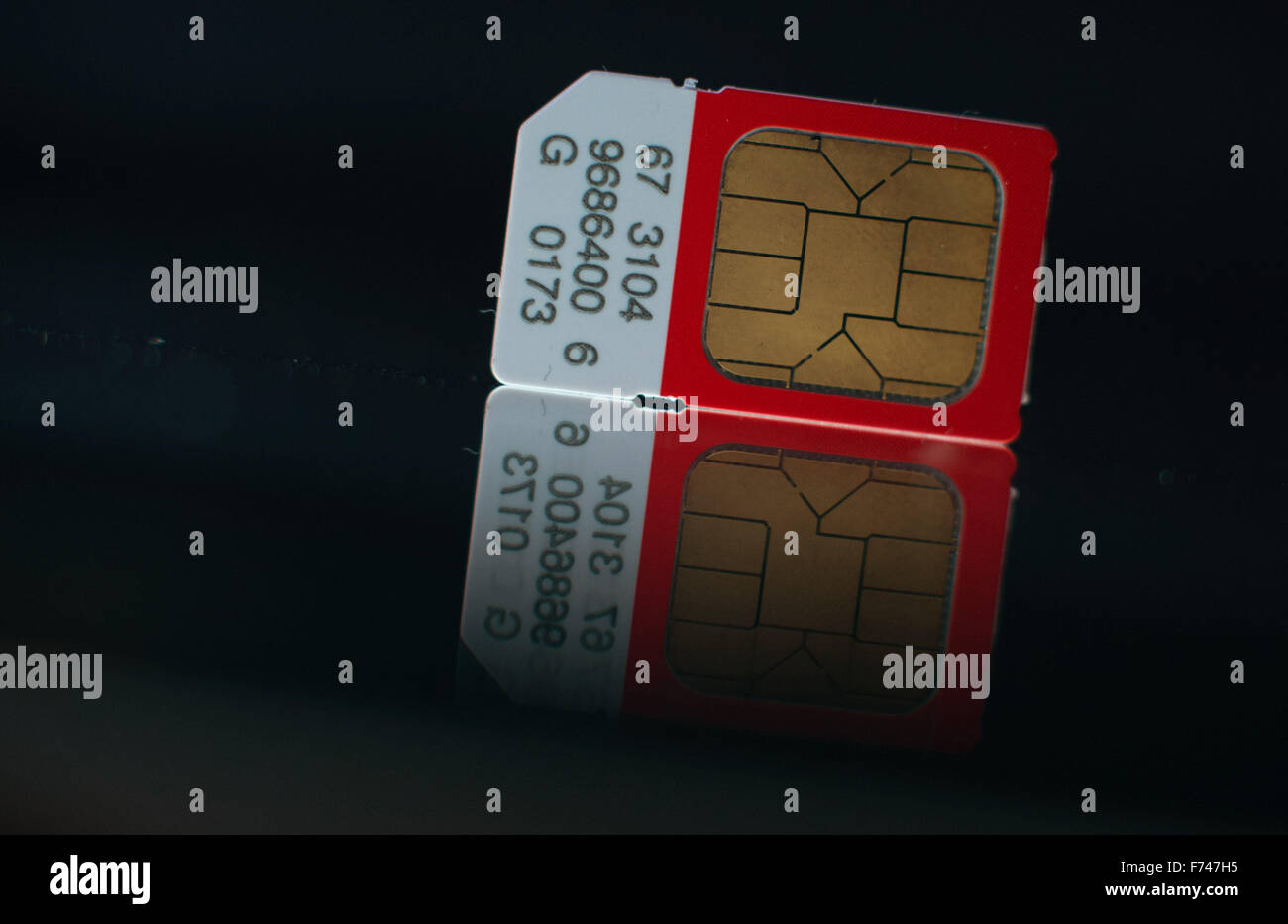 A SIM card sits on a mirror in Hanover, Germany, 24 November 2015. The ...