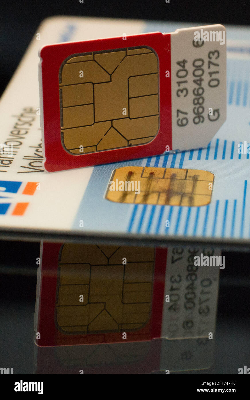 A SIM card and EC card sit on a mirror in Hanover, Germany, 24 November ...