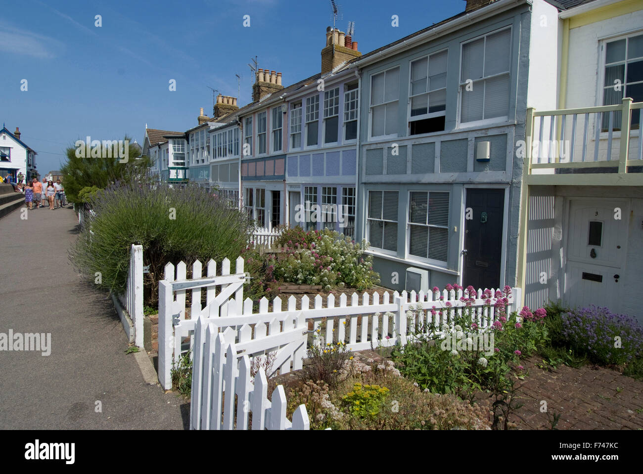 White picket fences in front of holiday waterside houses, Whitstable ...