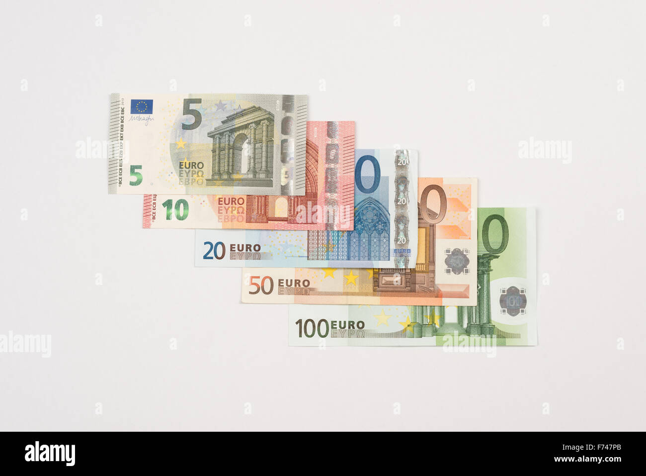 Ranging Euro notes isolated lying Stock Photo - Alamy