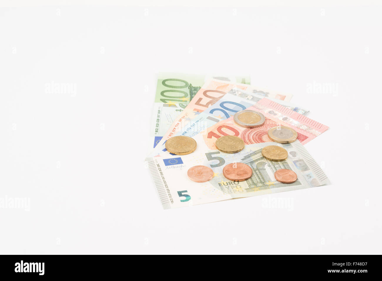 Various euro bills and coins with different value Stock Photo - Alamy