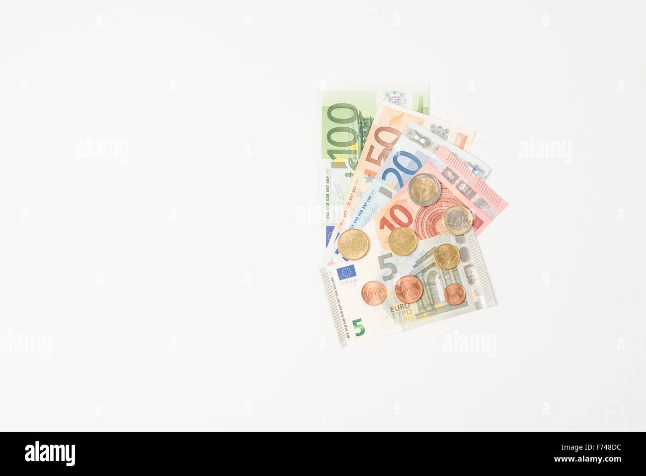 Various euro bills and coins with different value Stock Photo - Alamy