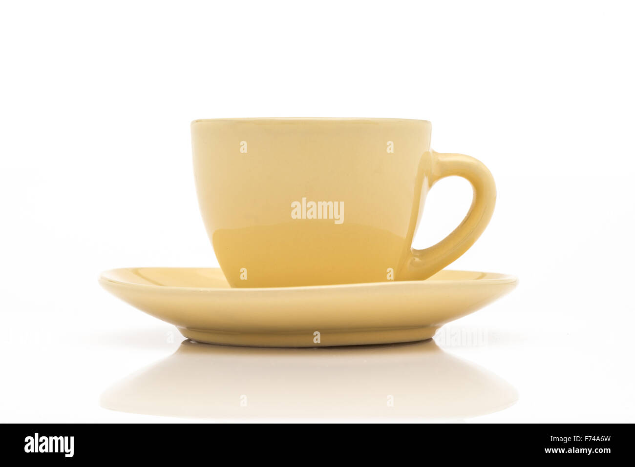 Cream colored espresso cup and saucer isolated on white background ...