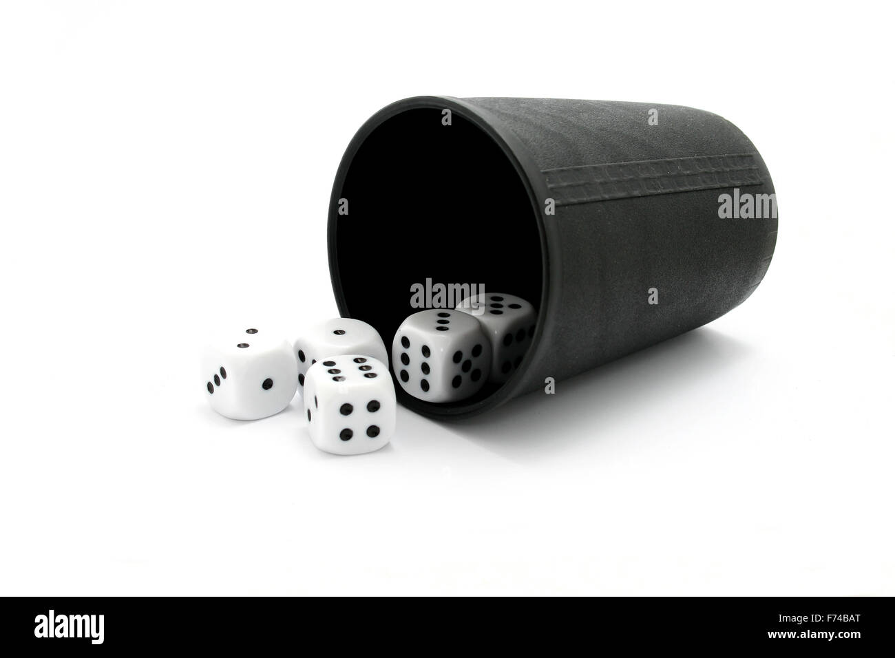 Dice with cup Stock Photo - Alamy