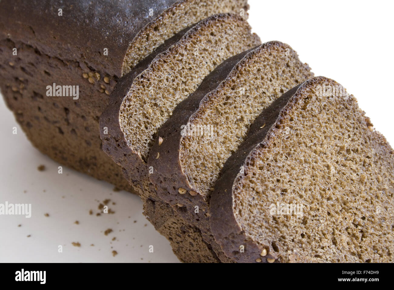 Loaf and slices of black bread Stock Photo - Alamy