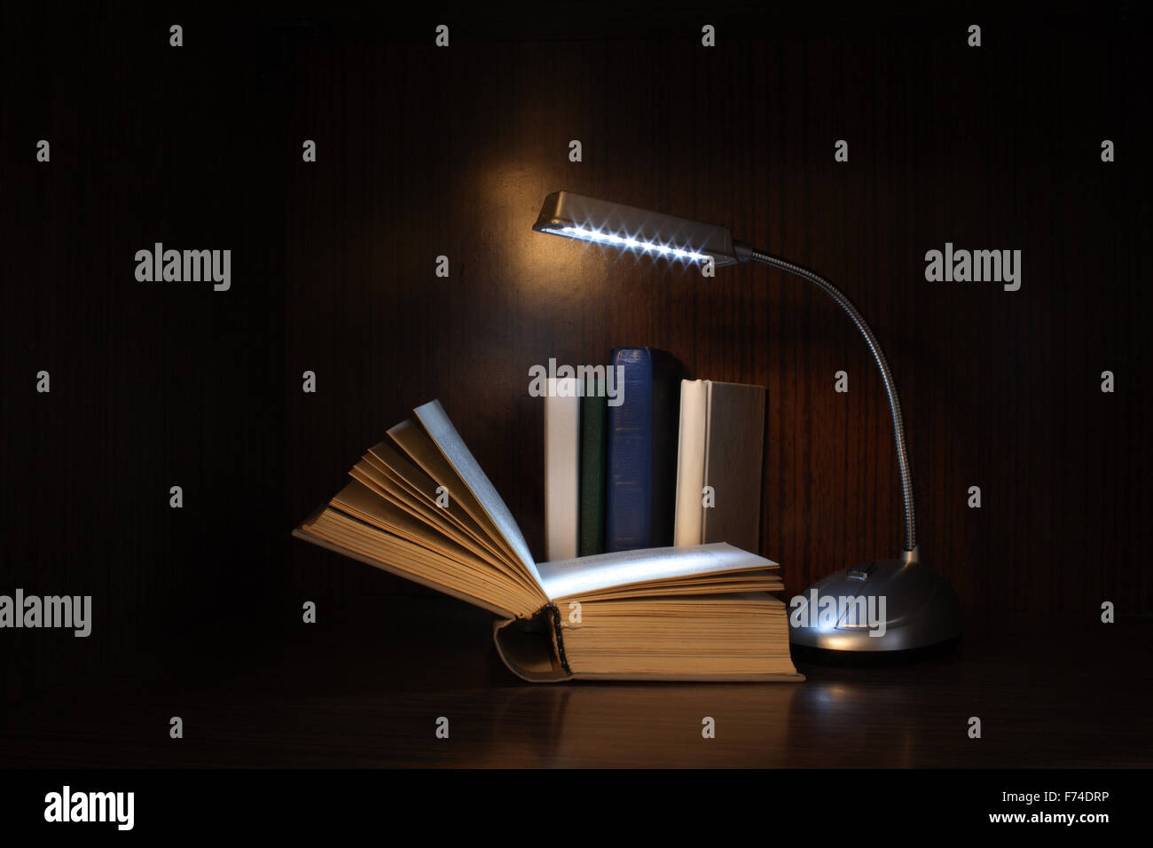 Books and lamp Stock Photo - Alamy