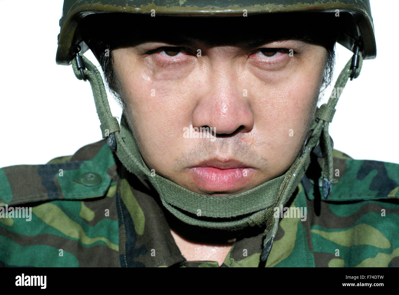 Agressive asian soldier with helmet Stock Photo - Alamy