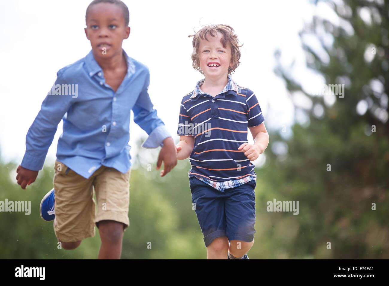 Two boys running at a friendly race Stock Photo - Alamy Two boys running at a friendly race Stock Photo - Alamy