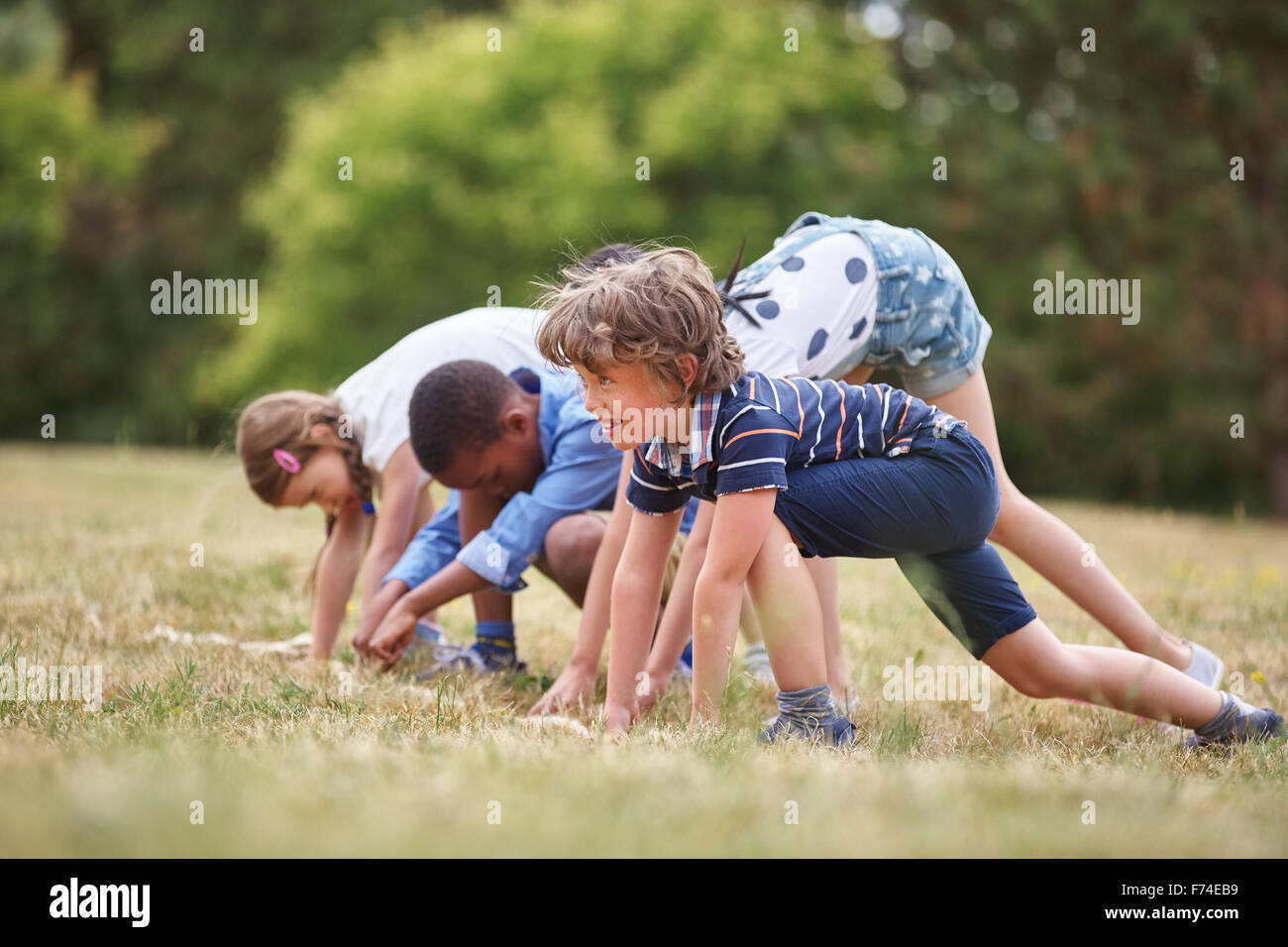 Children ready to race in a friendly competition Stock Photo - Alamy