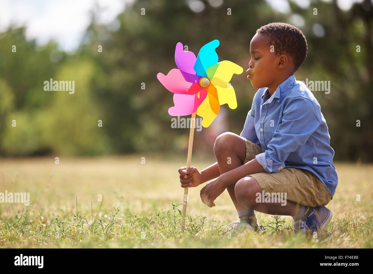 African kid playing with pinwheel at the park Stock Photo - Alamy
