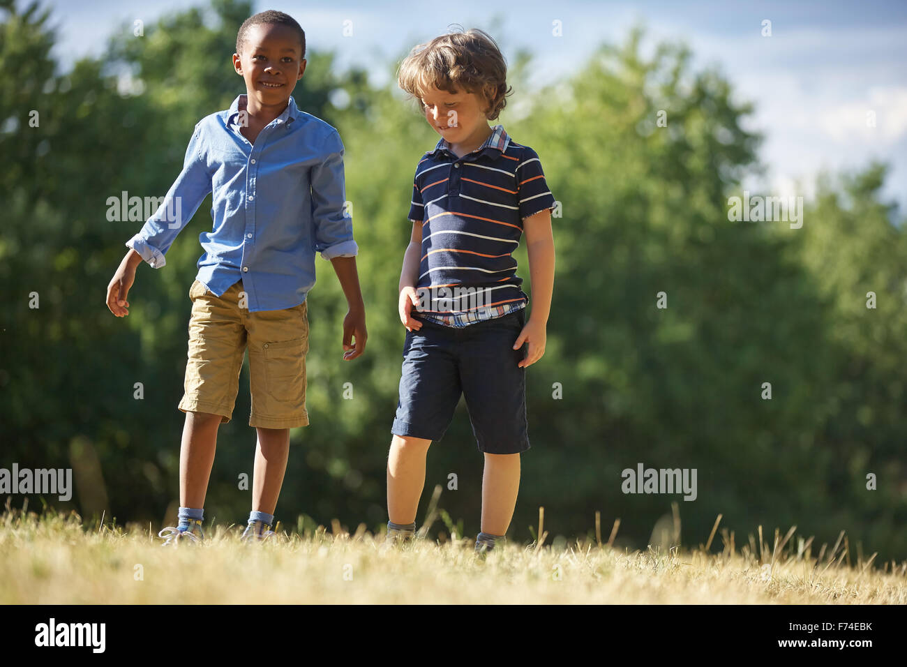 Two happy boys at the park smiling Stock Photo - Alamy