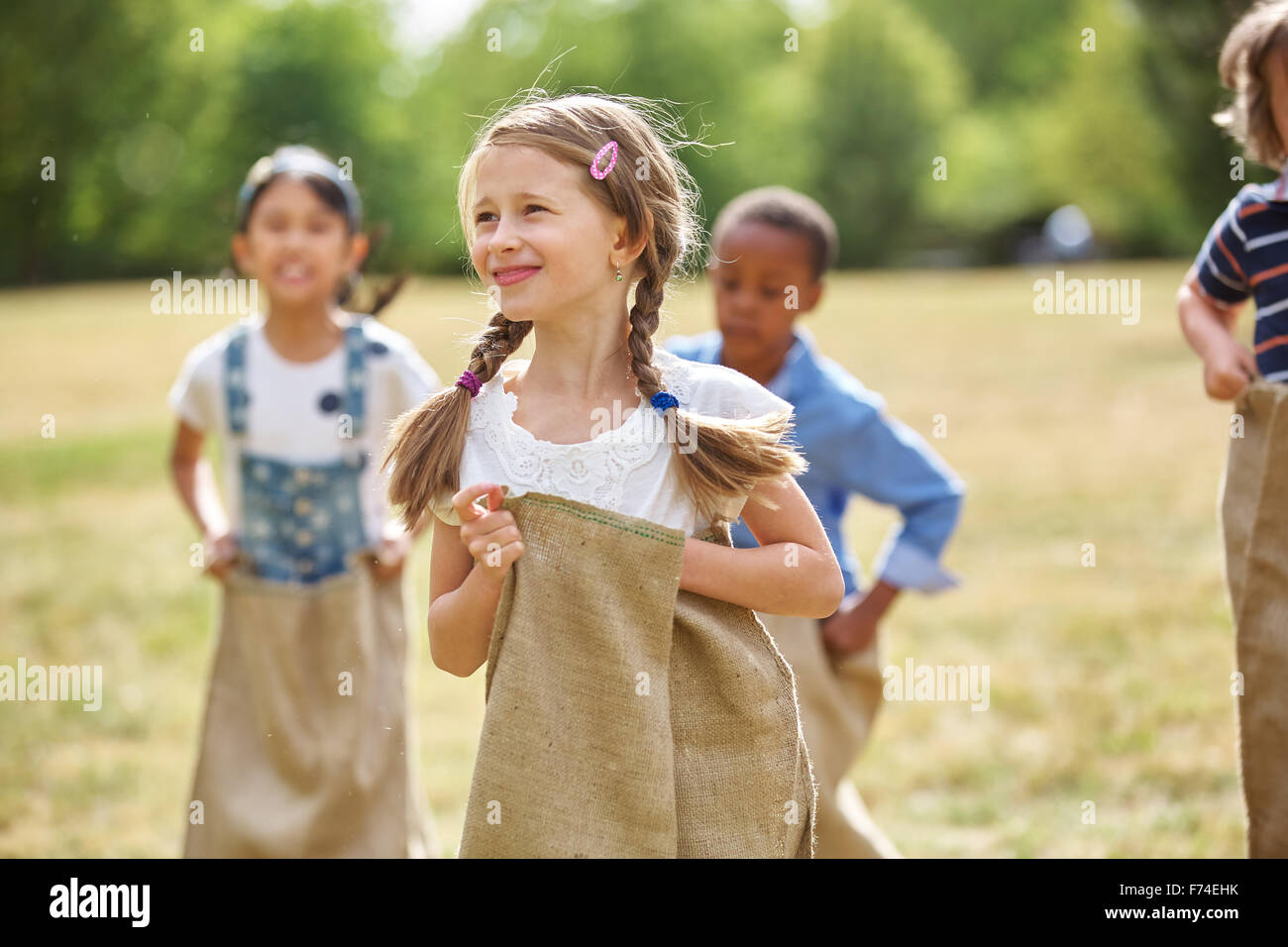Child sack race hi-res stock photography and images - Alamy