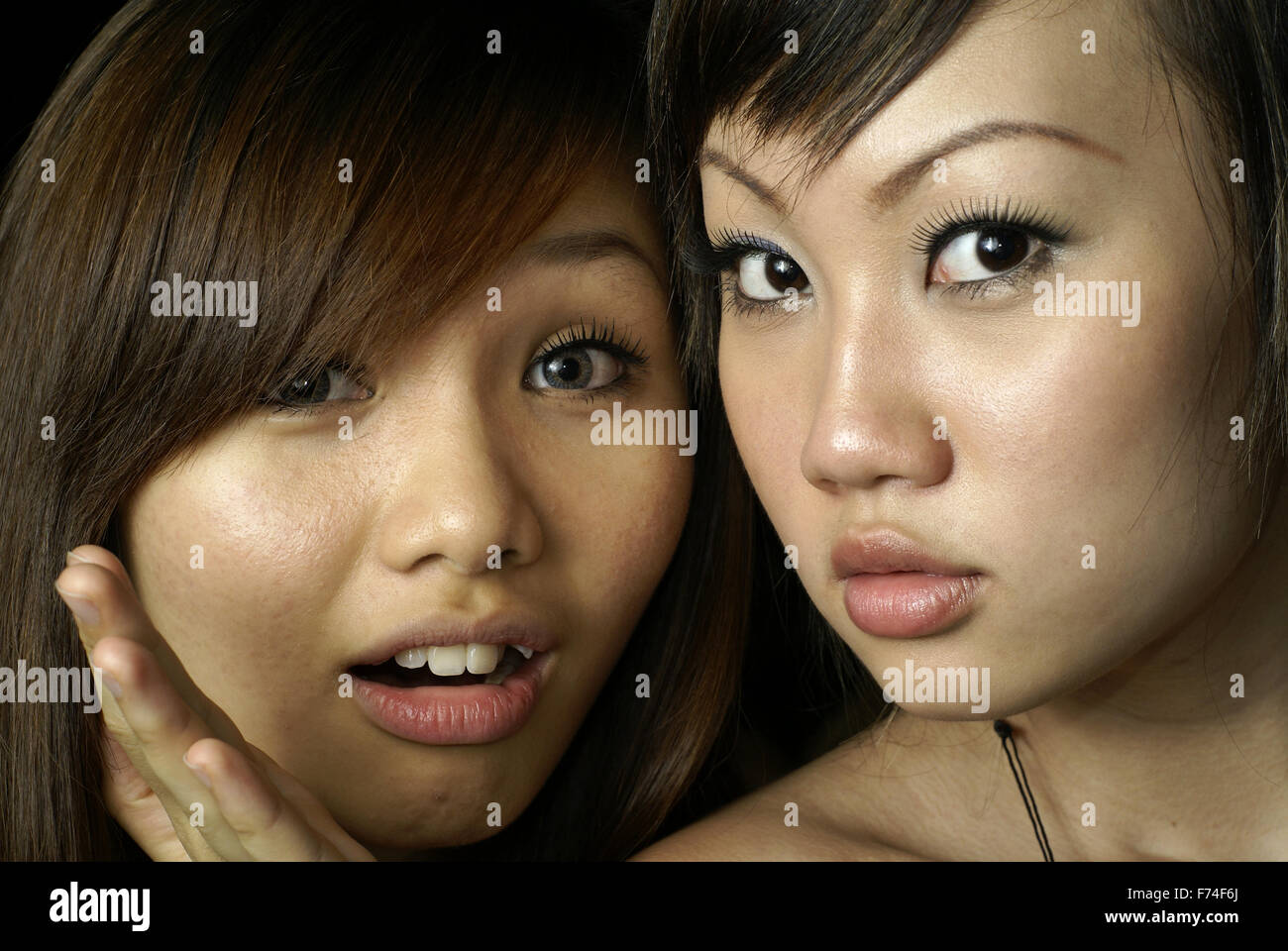 Two surprised asian lady friends Stock Photo - Alamy