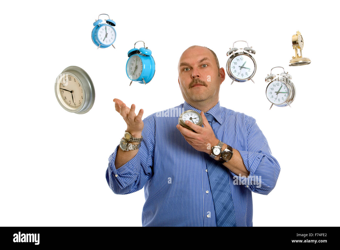 Businessman juggling alarm clocks hi-res stock photography and images ...