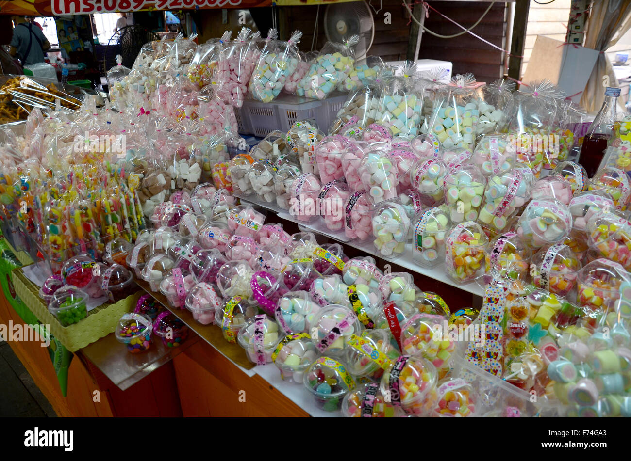 Colorful sweet snack and candy shop for sale at Don Wai Floating Market ...
