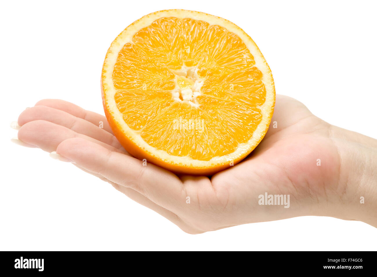Hand holding half orange Cut Out Stock Images & Pictures - Alamy