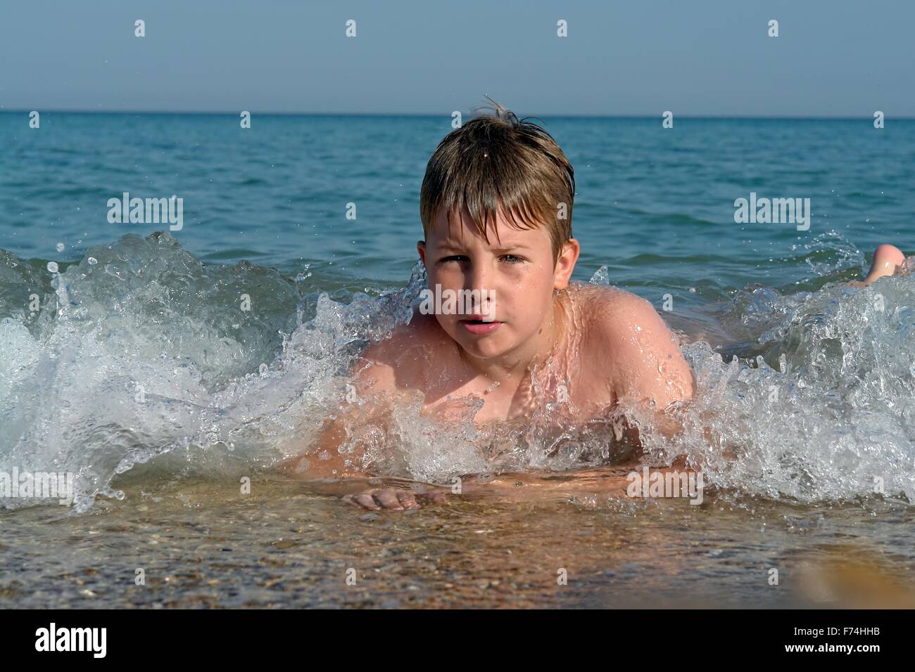Boy at beach Stock Photo - Alamy