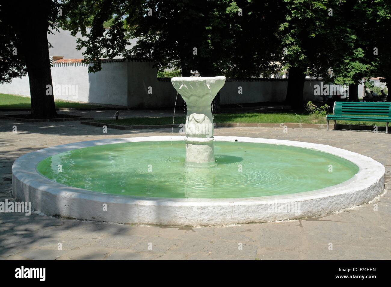 Small fountain with thin jets of water Stock Photo - Alamy