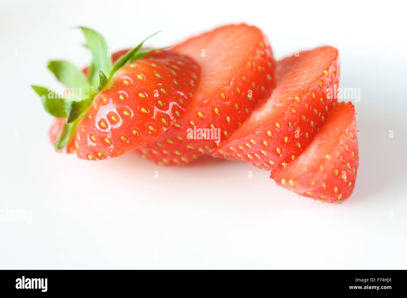 Freshly cut strawberry Stock Photo - Alamy
