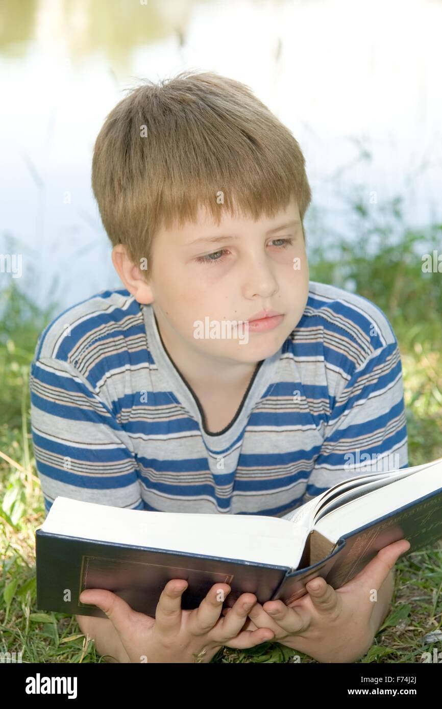 boy reads book Stock Photo - Alamy